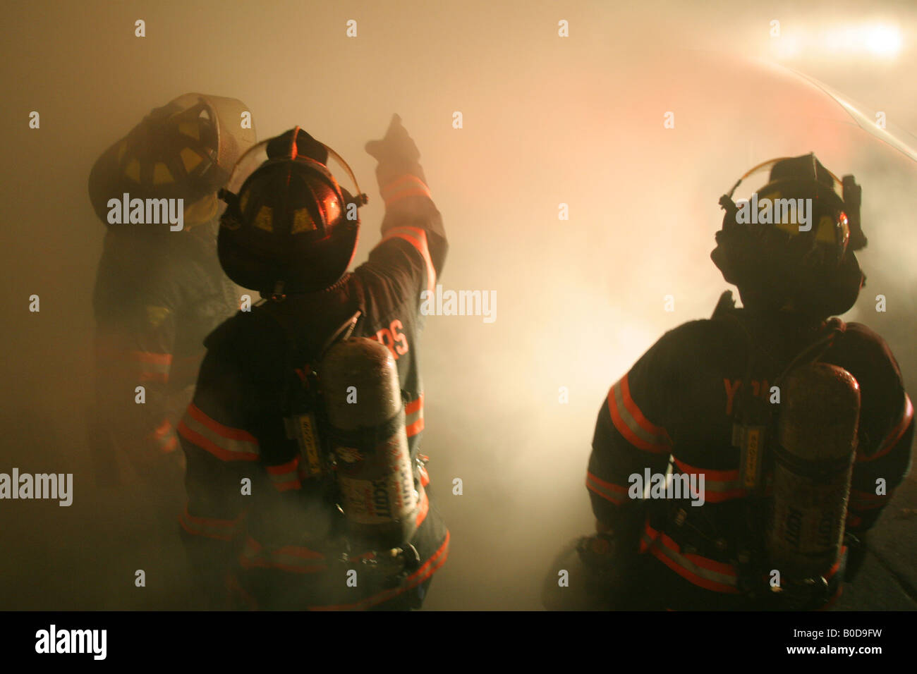 Firefighters in smoke filled room, by Michael Messar/Dembinsky Photo ...