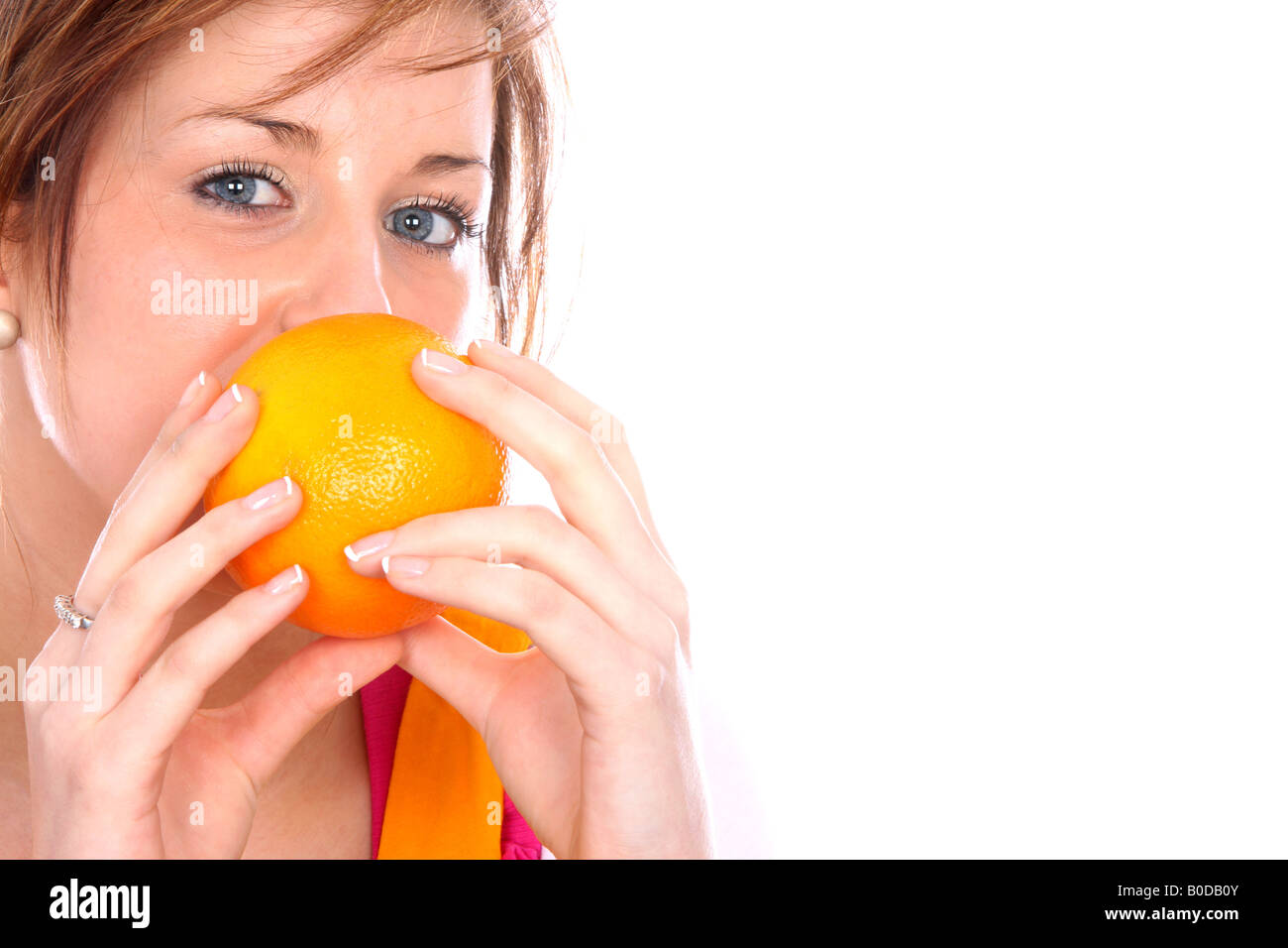 Teenage Girl Smelling Orange Model Released Stock Photo - Alamy
