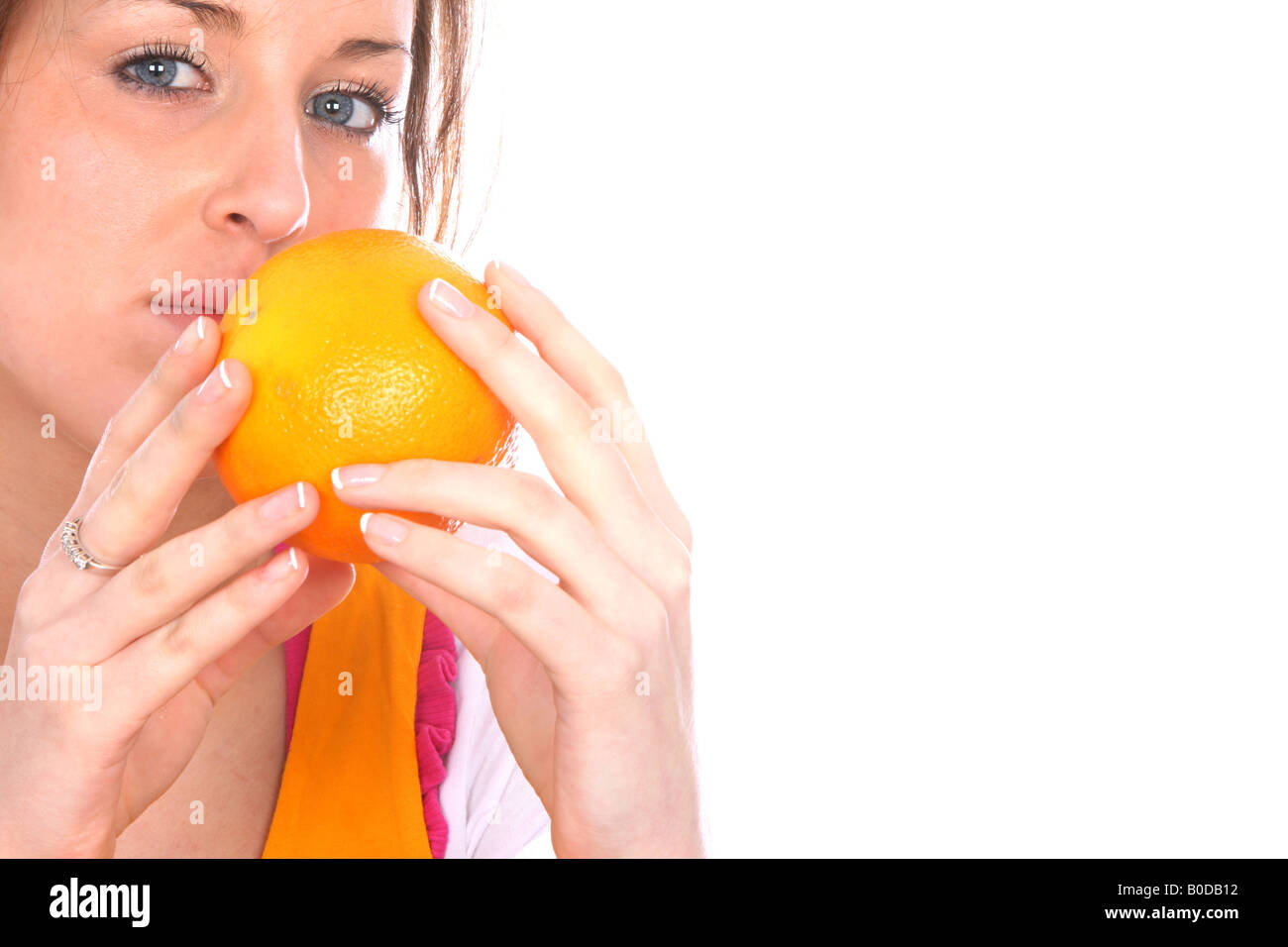 Teenage Girl Smelling Orange Model Released Stock Photo - Alamy