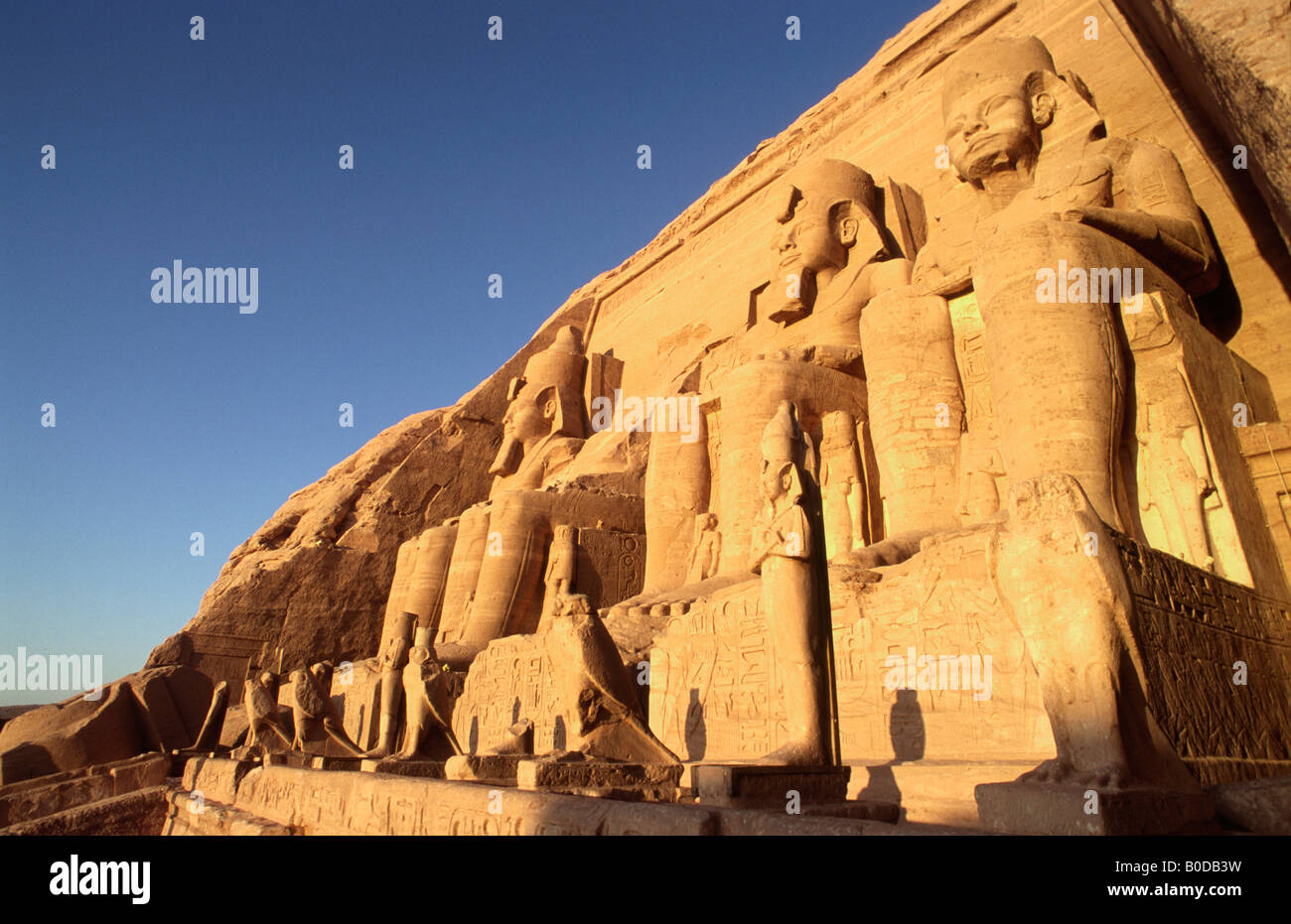 Giant statues of Ramses II at the Abu Simbel Temple at sunrise Stock ...