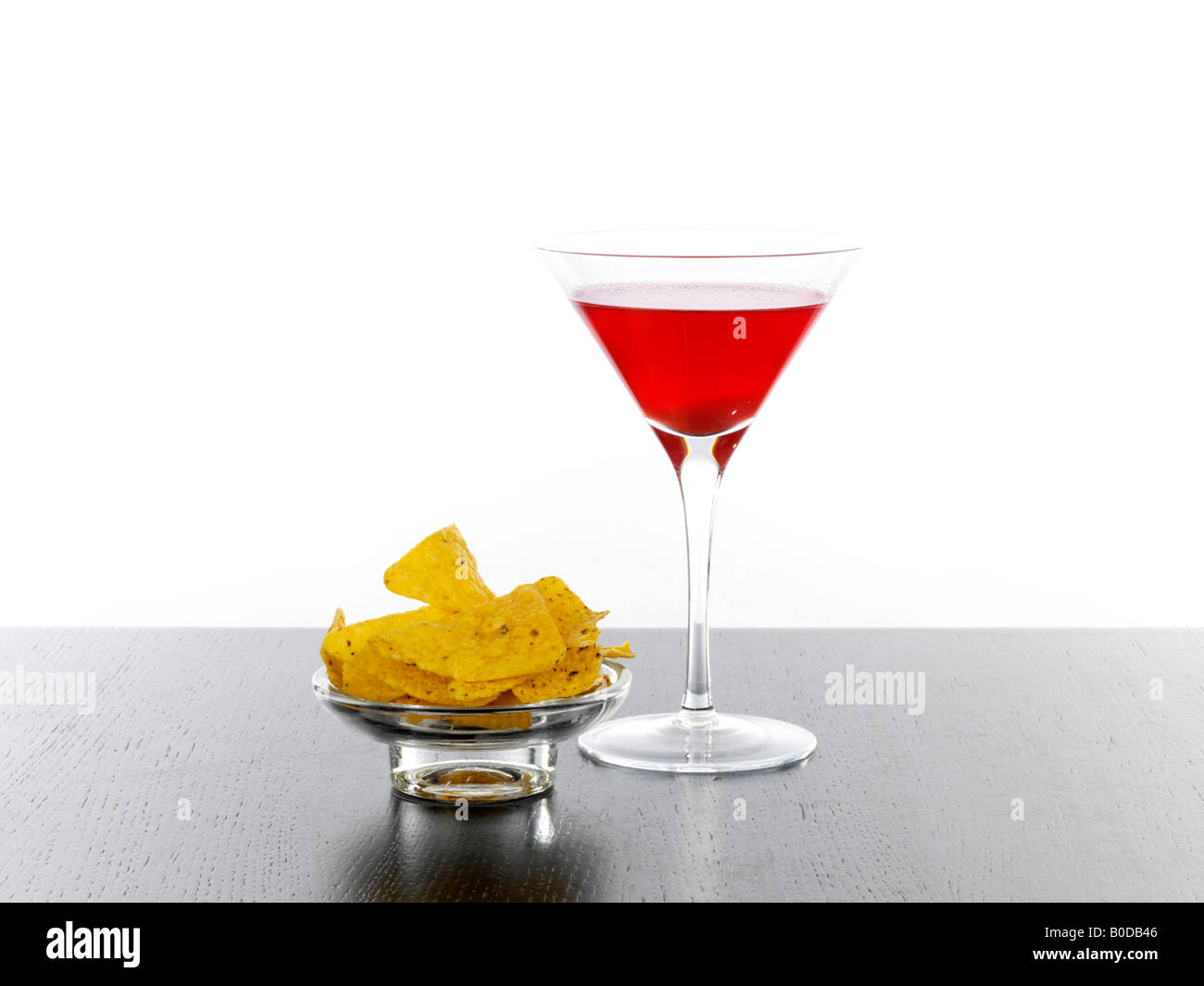 Cosmopolitan Cocktail with Plain Tortilla Chips Stock Photo - Alamy