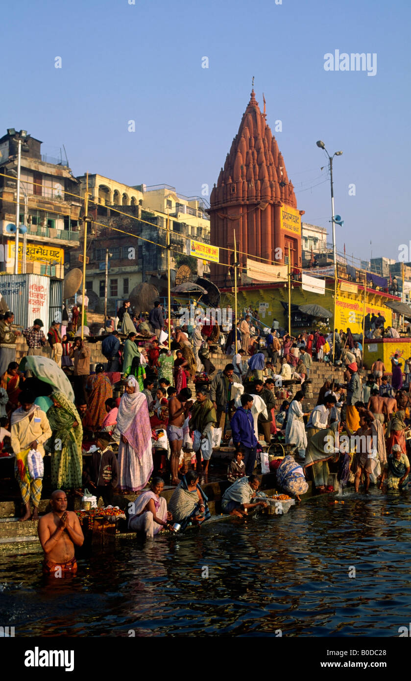Hindu pilgrims in Varanasi taking a ritual morning dip in the holy ...
