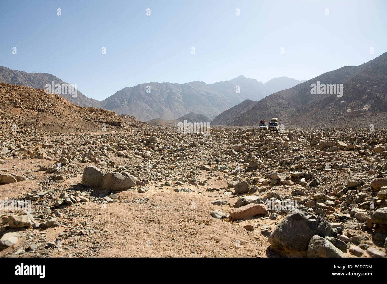 Vehicles driving in the wadi bed at Mons Porphyrites, Red Sea Hills ...