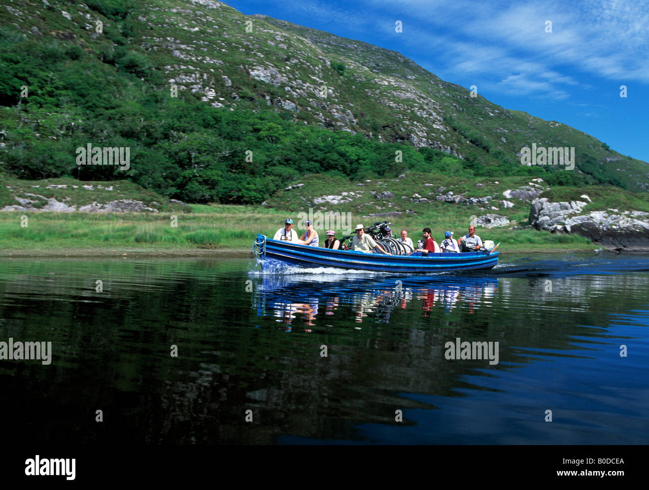 people in a motor boat Stock Photo - Alamy