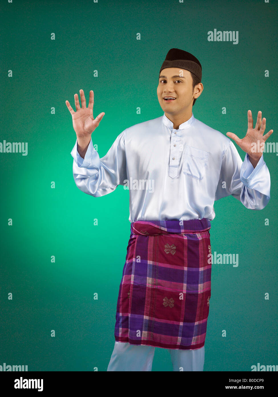Young malay man smiling and excited Stock Photo - Alamy