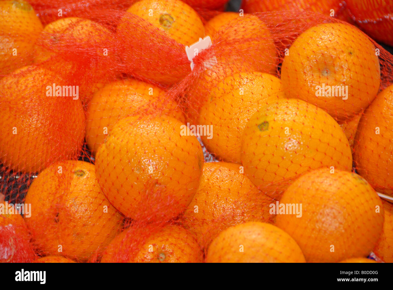 A group of ripe oranges in the produce aisle of a grocery store Stock ...