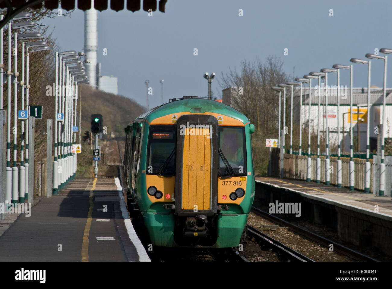 Train leaving station Stock Photo - Alamy