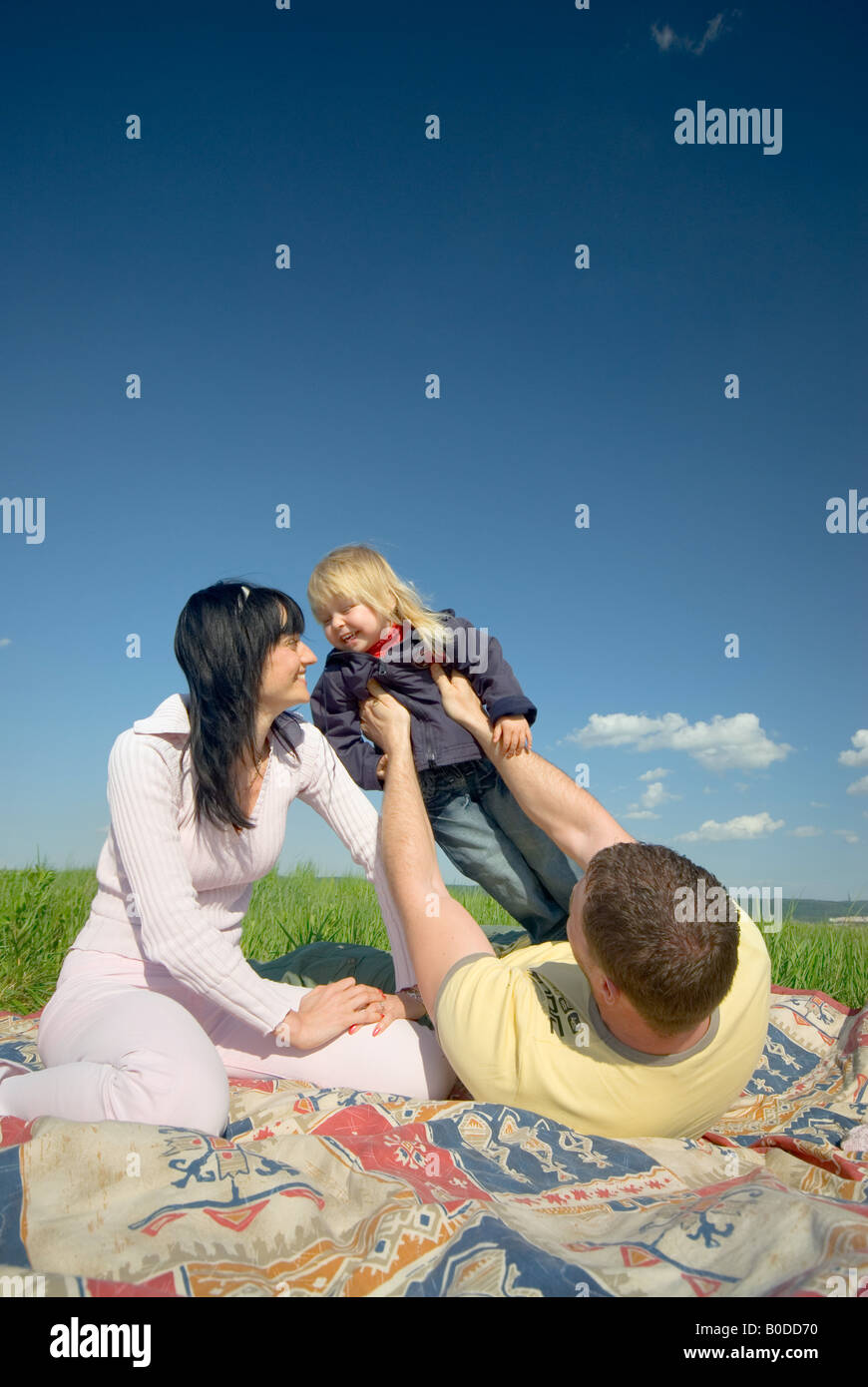 Happy family in nature Stock Photo - Alamy