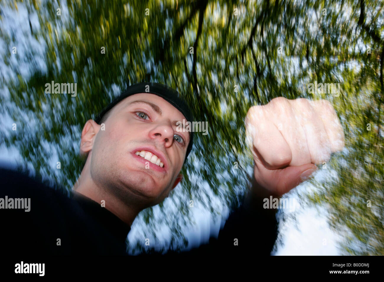 Portrait of a white boy throwing a punch Stock Photo - Alamy
