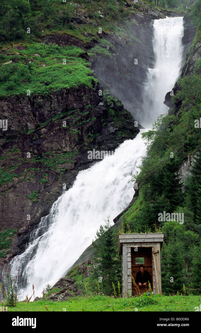 Man in an outdoor toilet with a view Stock Photo - Alamy