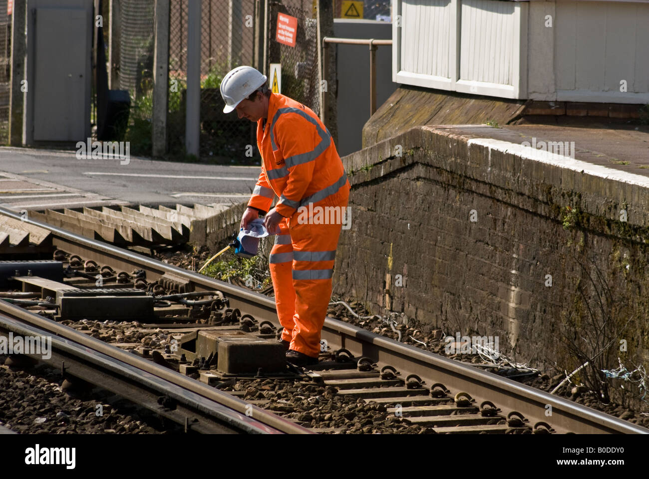 Man working track maintenance Stock Photo - Alamy