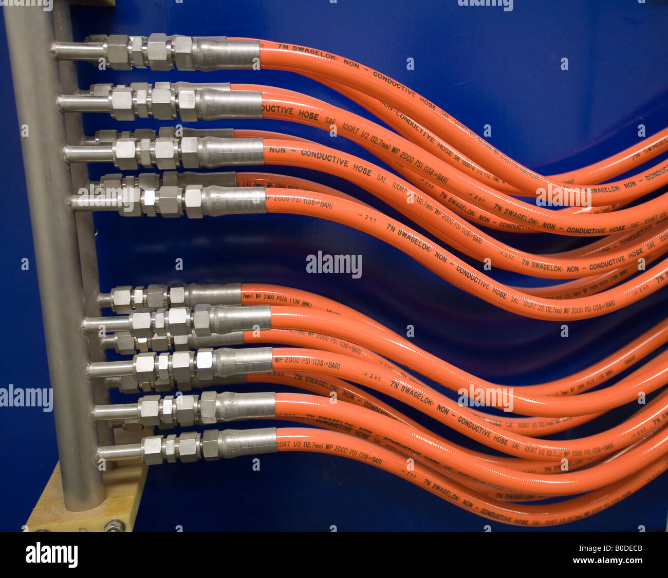 Swooping Industrial piping High pressure orange hoses swoop and connect ...