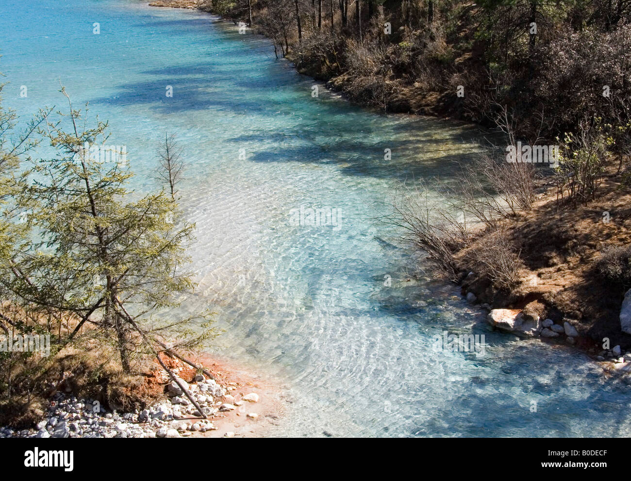 Clear blue water of the Jade Water Lake at Ganhaizi around Lijiang ...