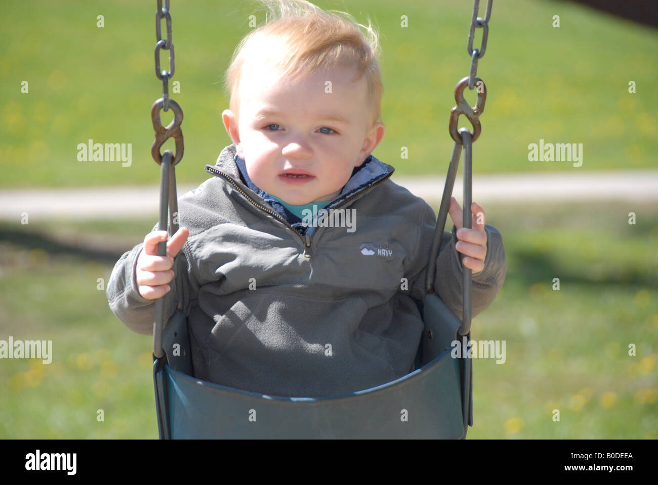 Push swing child playground hi-res stock photography and images - Alamy