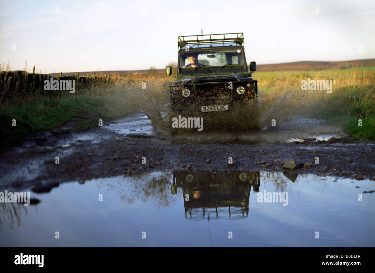 Defender driving through water hi-res stock photography and images - Alamy