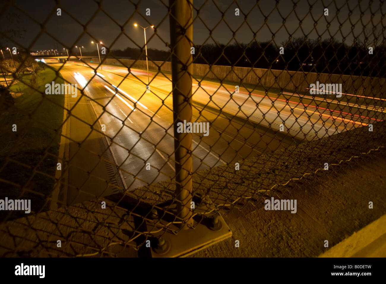 A busy interstate highway at night, with traffic streaking by Stock ...