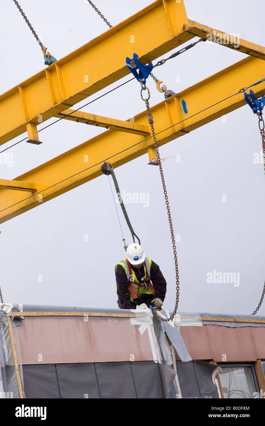 Attaching chains for crane lift to jib Stock Photo - Alamy
