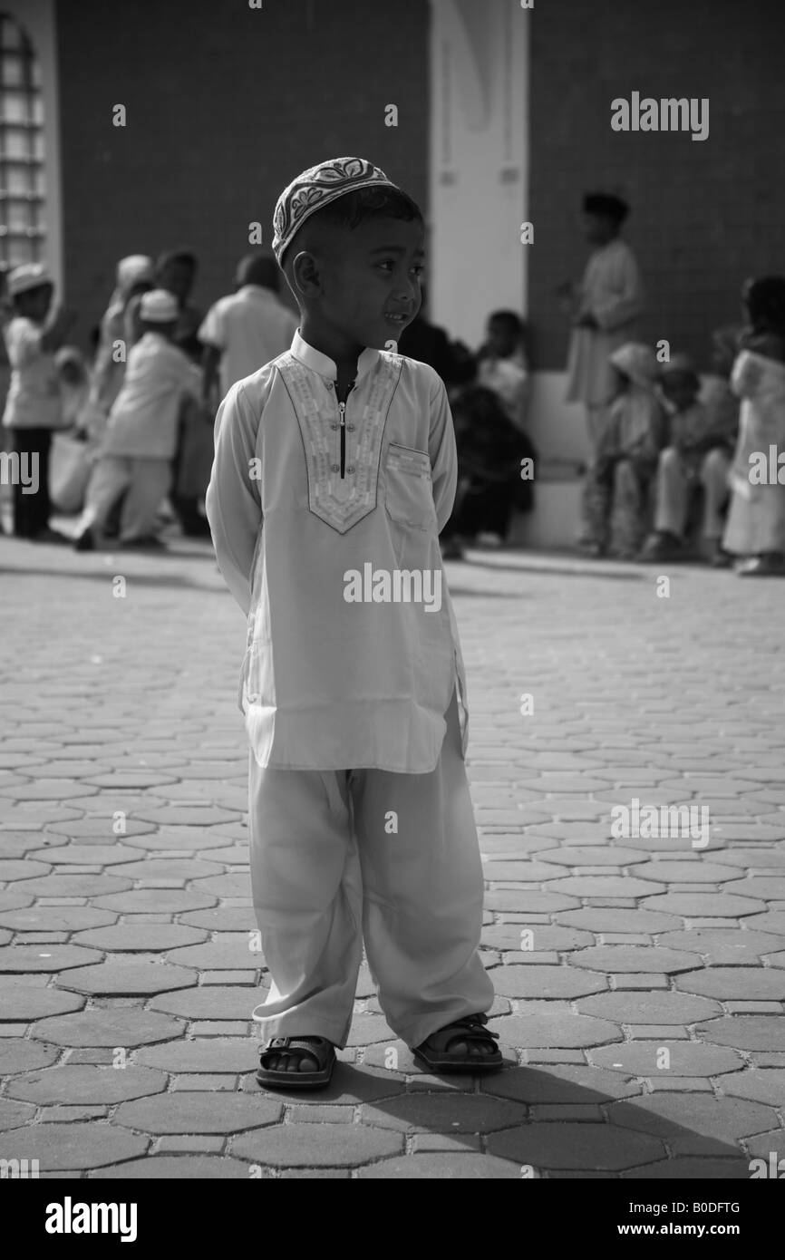 a pride little muslim boy on eid ul fitr day, outside mosgue, koh samui ...