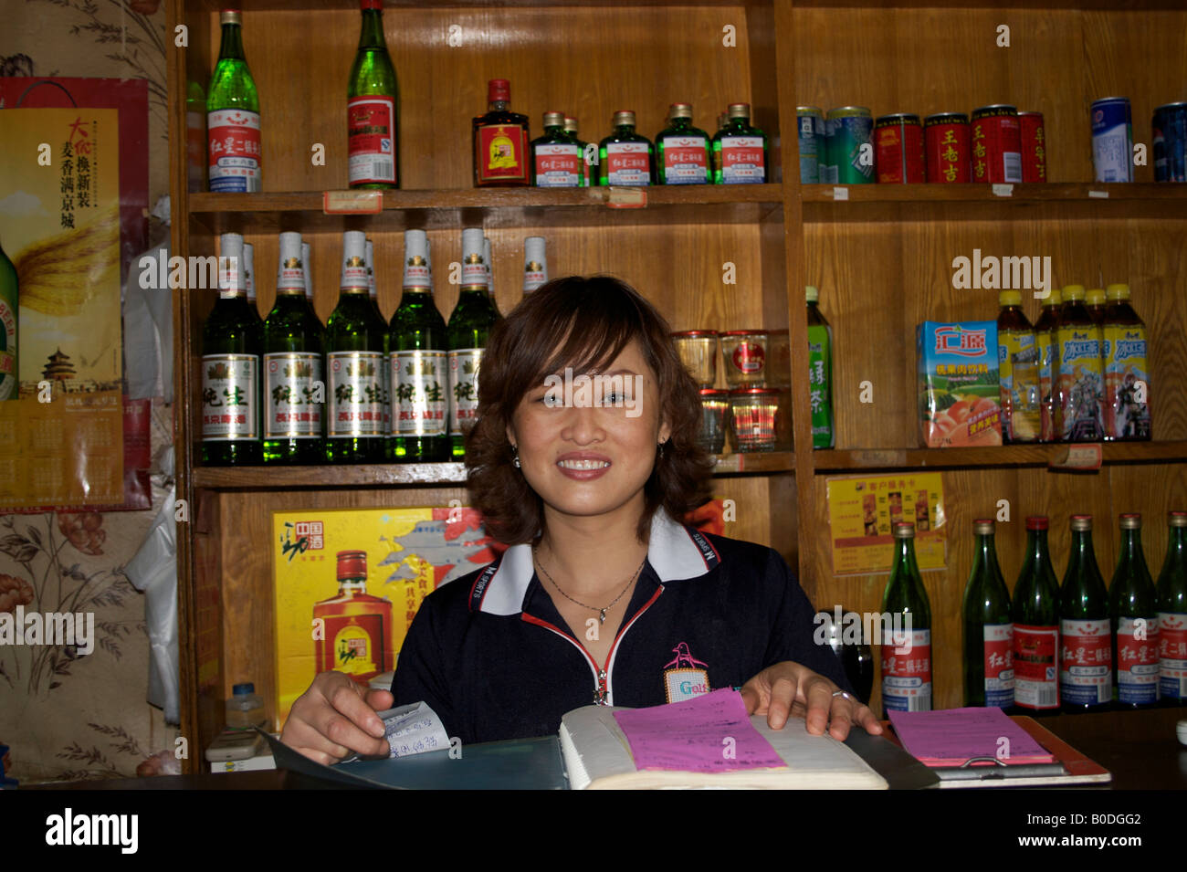 A smiling waitress in a restaurant Beijing China Stock Photo - Alamy