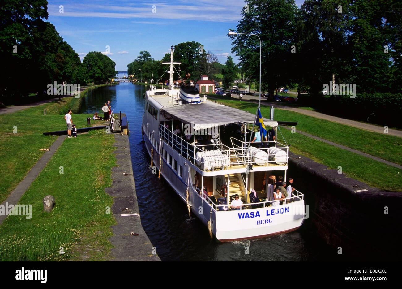 Boat passing Bergs Slussar, waterlocks on Gota Kanal, the canal built ...