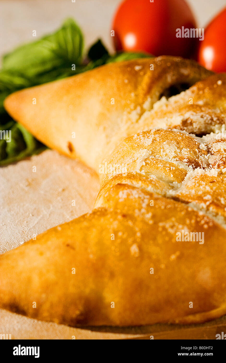 Fresh basil and tomato calzone Stock Photo - Alamy