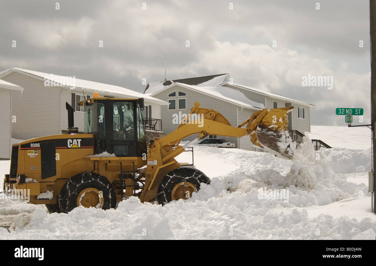 Front-end loader clearing the streets after blizzard dumped over thre ...