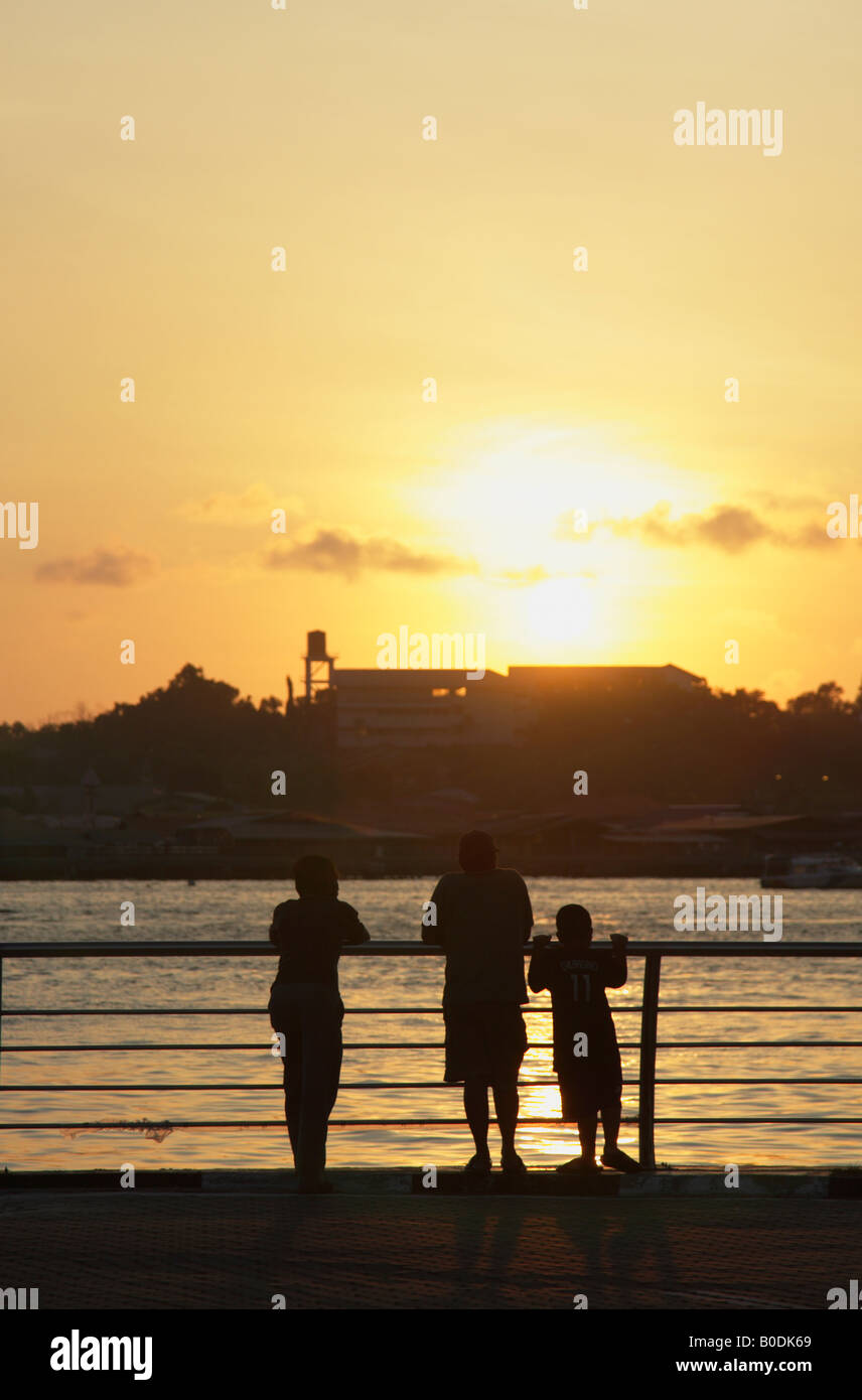 Three People Watching Sunset, Pulau Labuan, Sabah, Malaysian Borneo ...