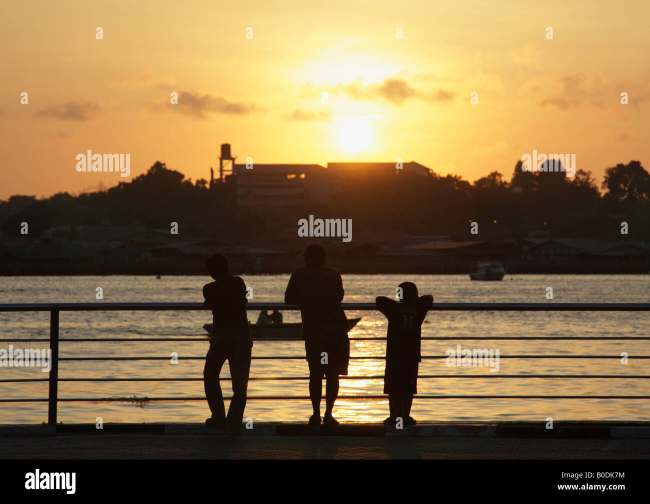 Three People Watching Sunset, Pulau Labuan, Sabah, Malaysian Borneo ...