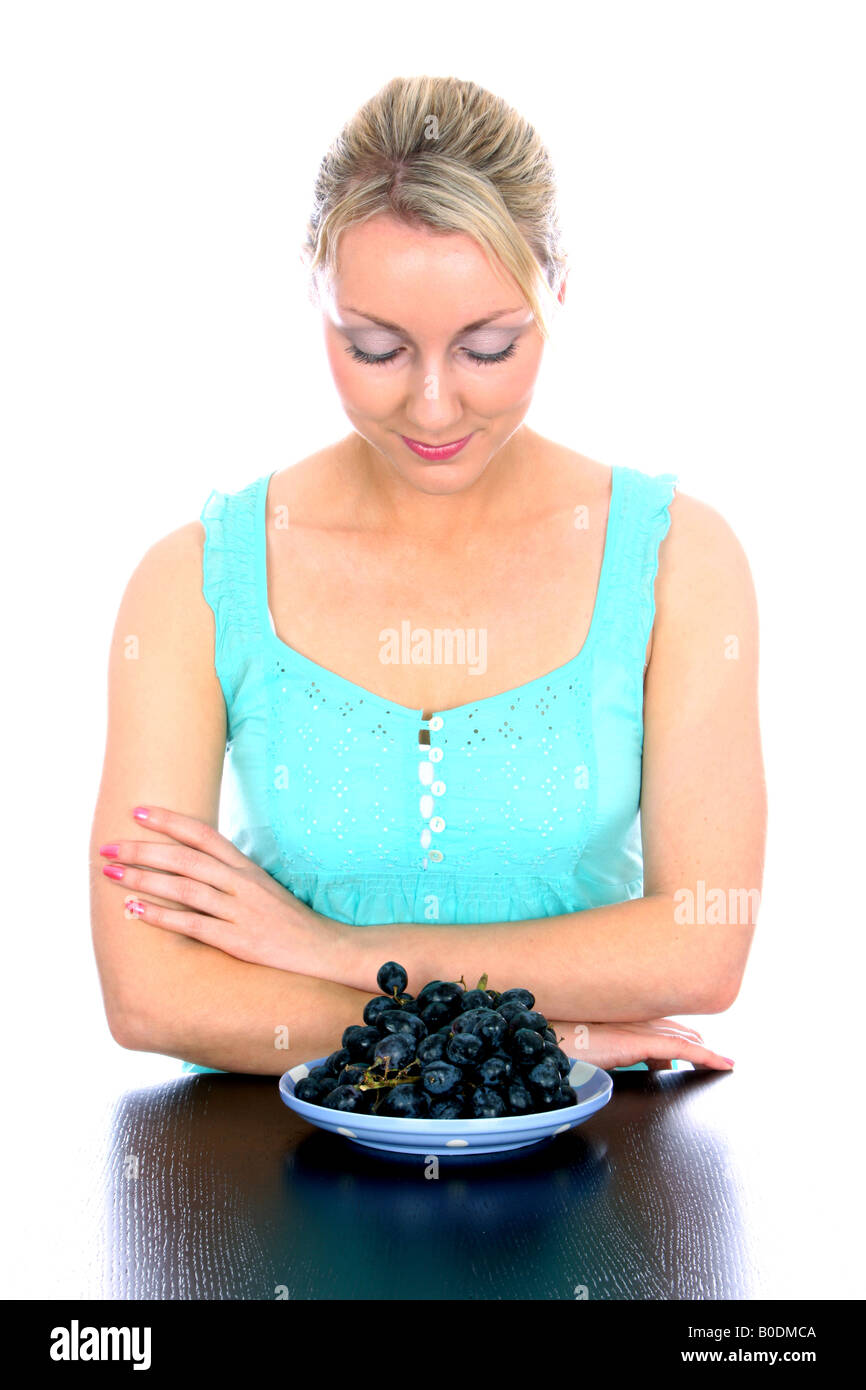 Young Woman with Bowl of Black Grapes Model Released Stock Photo - Alamy