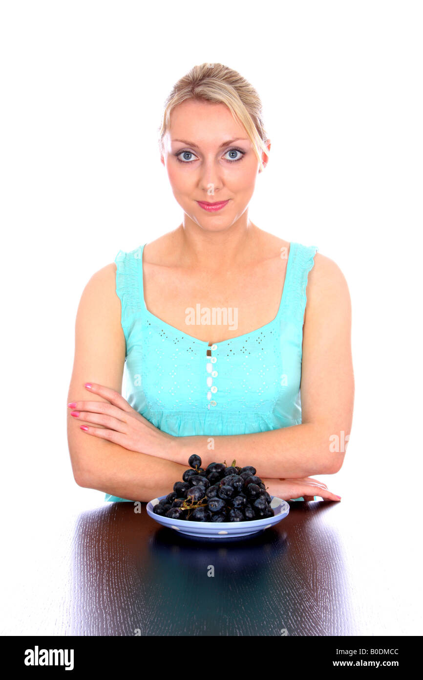 Young Woman with Bowl of Black Grapes Model Released Stock Photo - Alamy