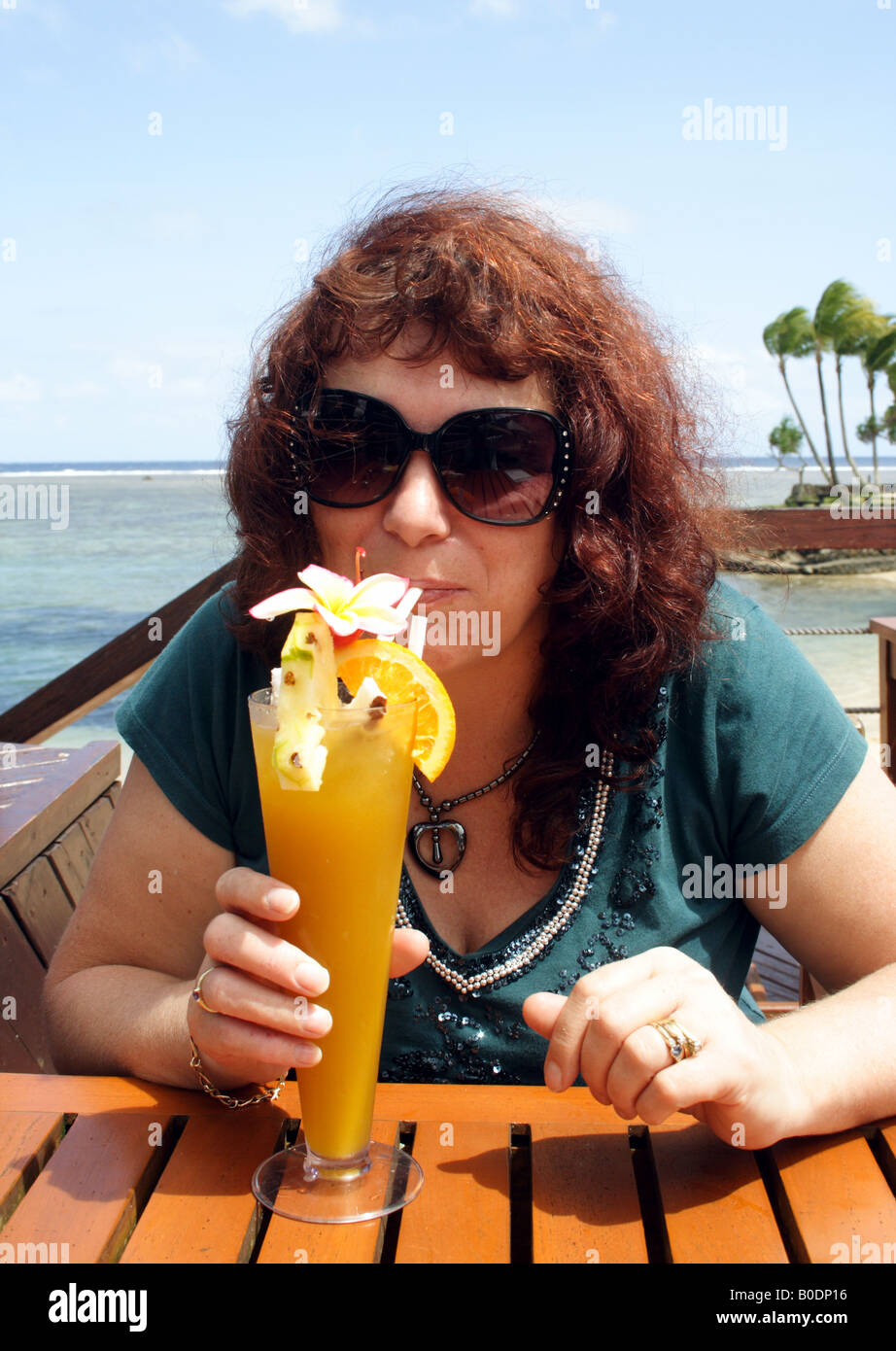 A LADY SIPPING A TROPICAL COCKTAIL DRINK FIJIAN ISLAND RESORT BDA11498 ...