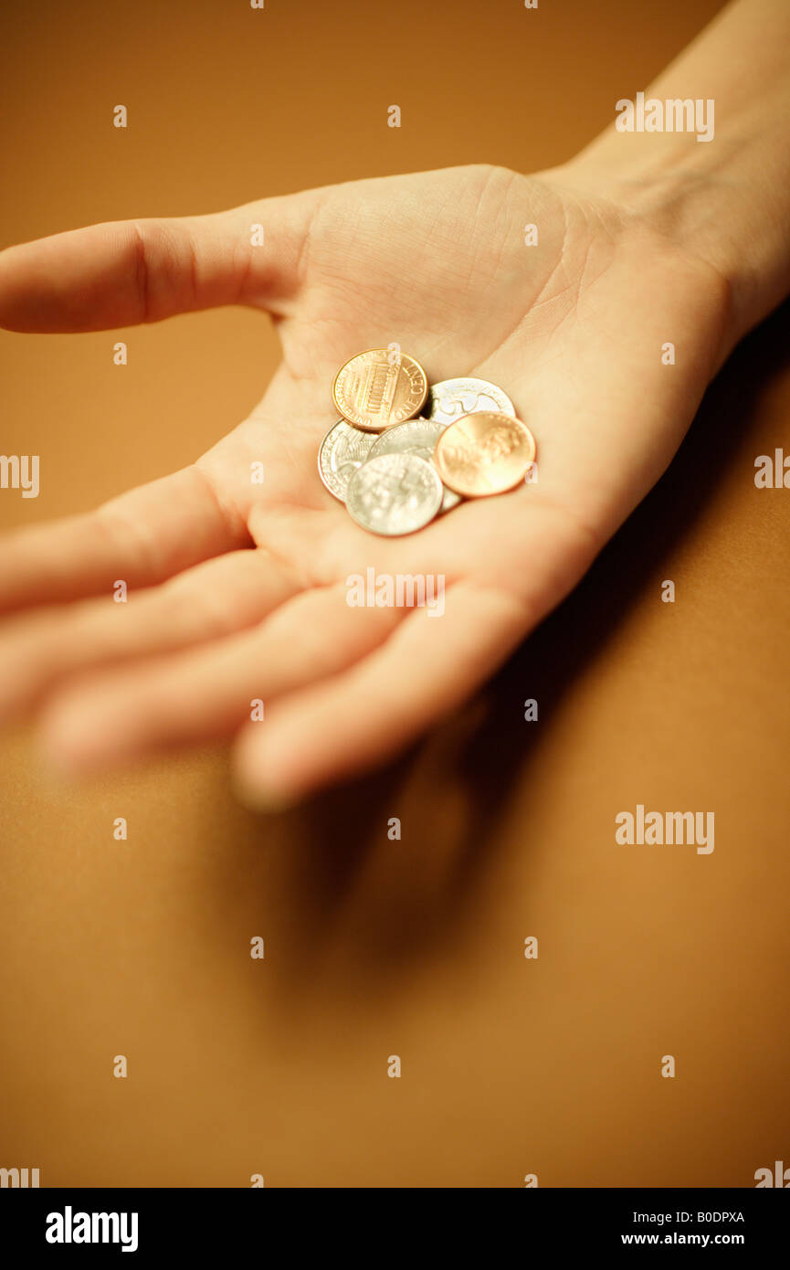 palm of a hand with coins Stock Photo - Alamy