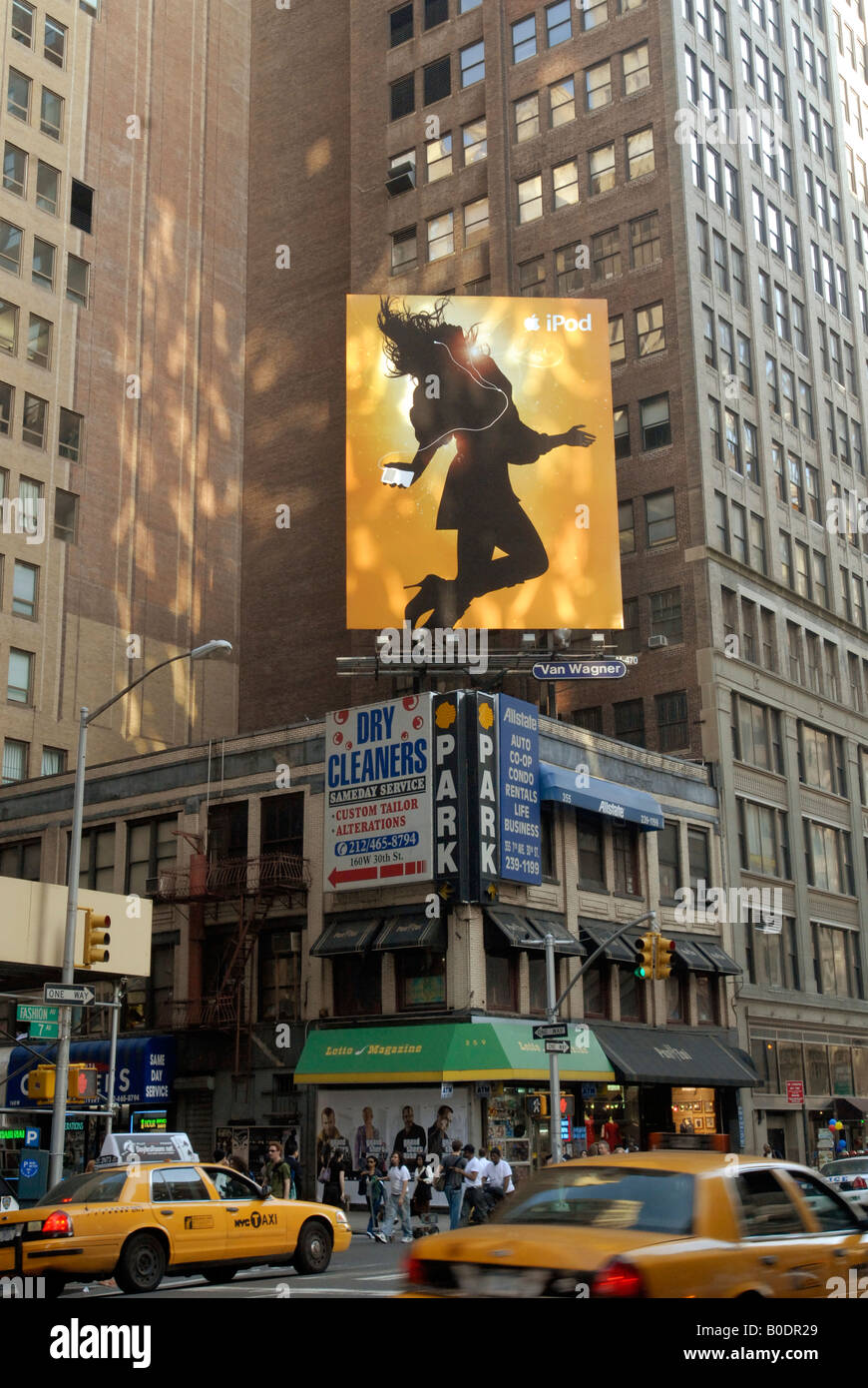 Advertising for the Apple Inc iPod on a billboard in the Chelsea ...