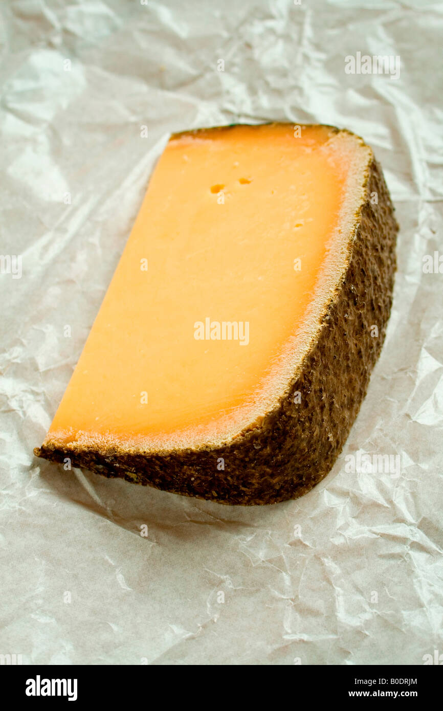 Cheese with rosemary rind Stock Photo - Alamy