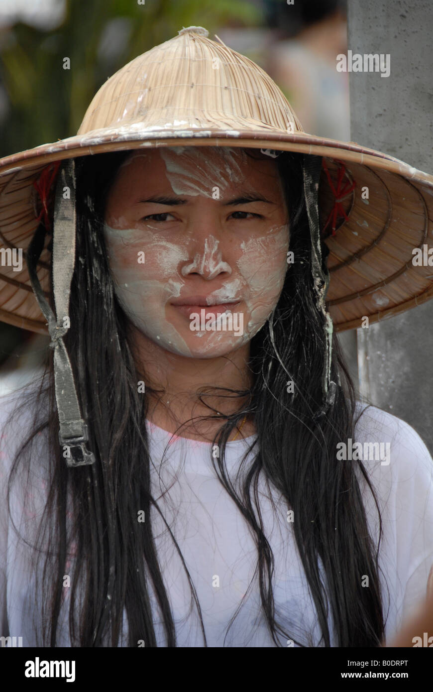 lady with white clay filler on her face during songkran festival ...