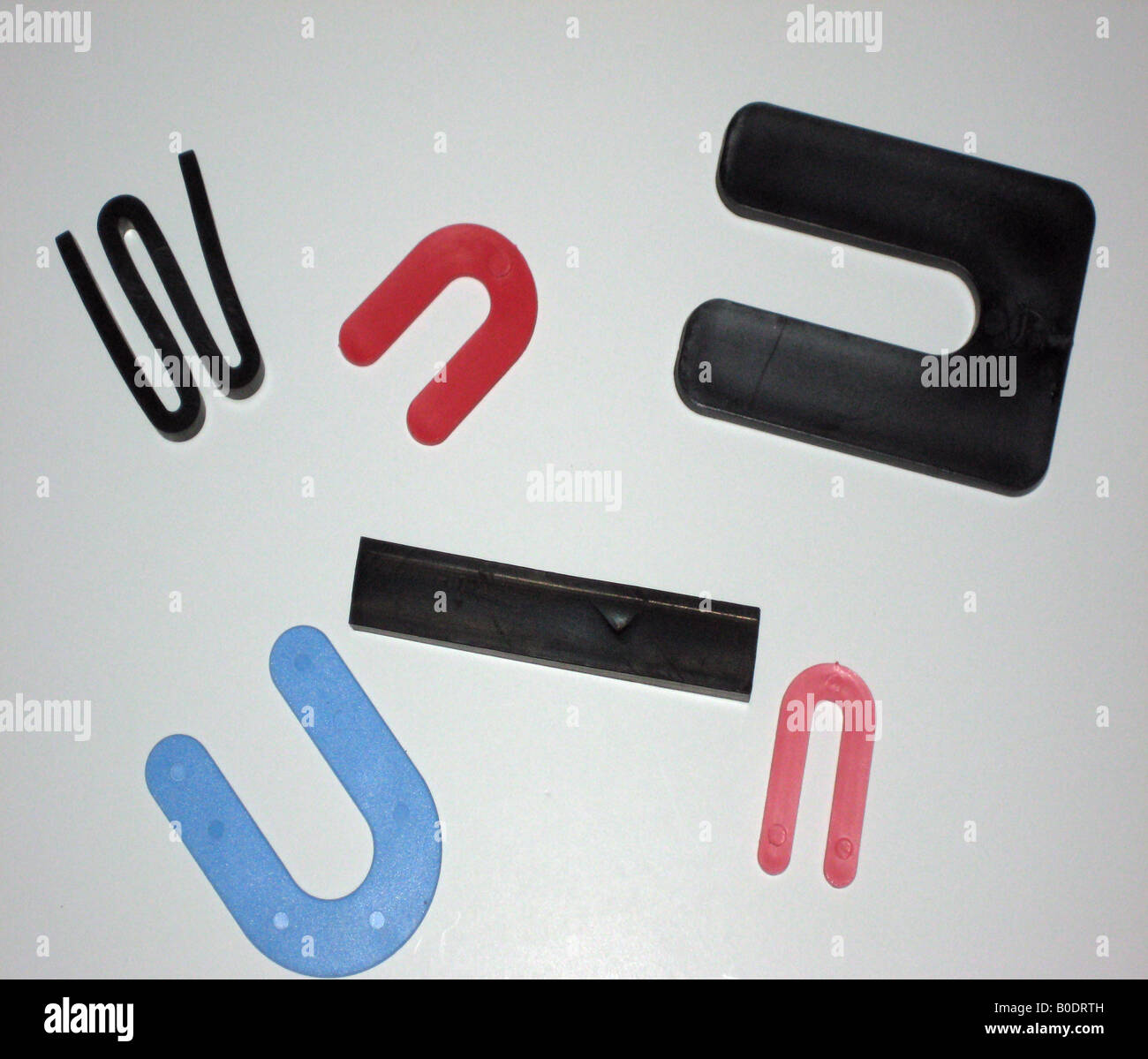 Color photo of plastic construction horse shoe shims, setting blocks ...