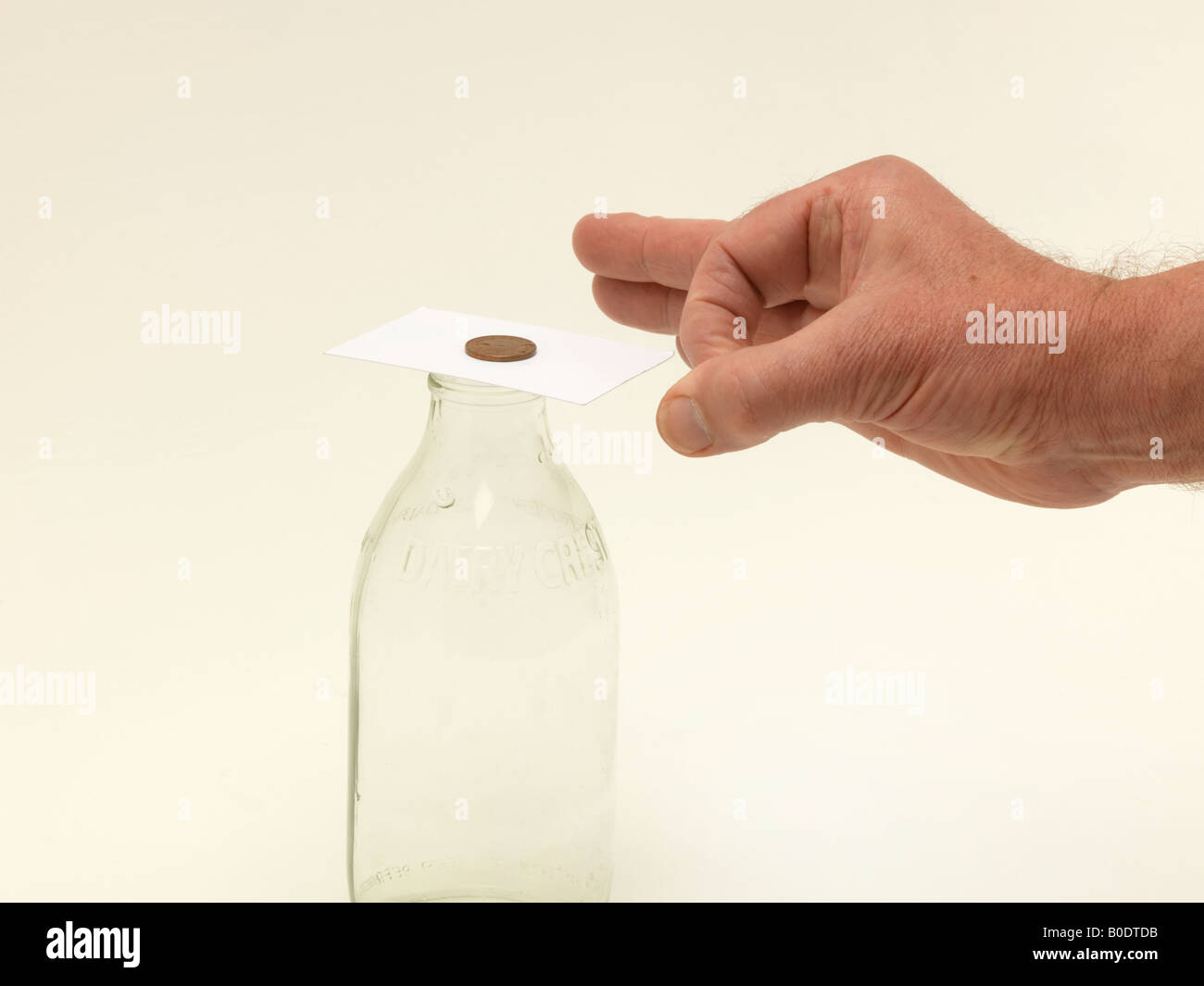 Card Coin and Bottle Trick Stock Photo - Alamy