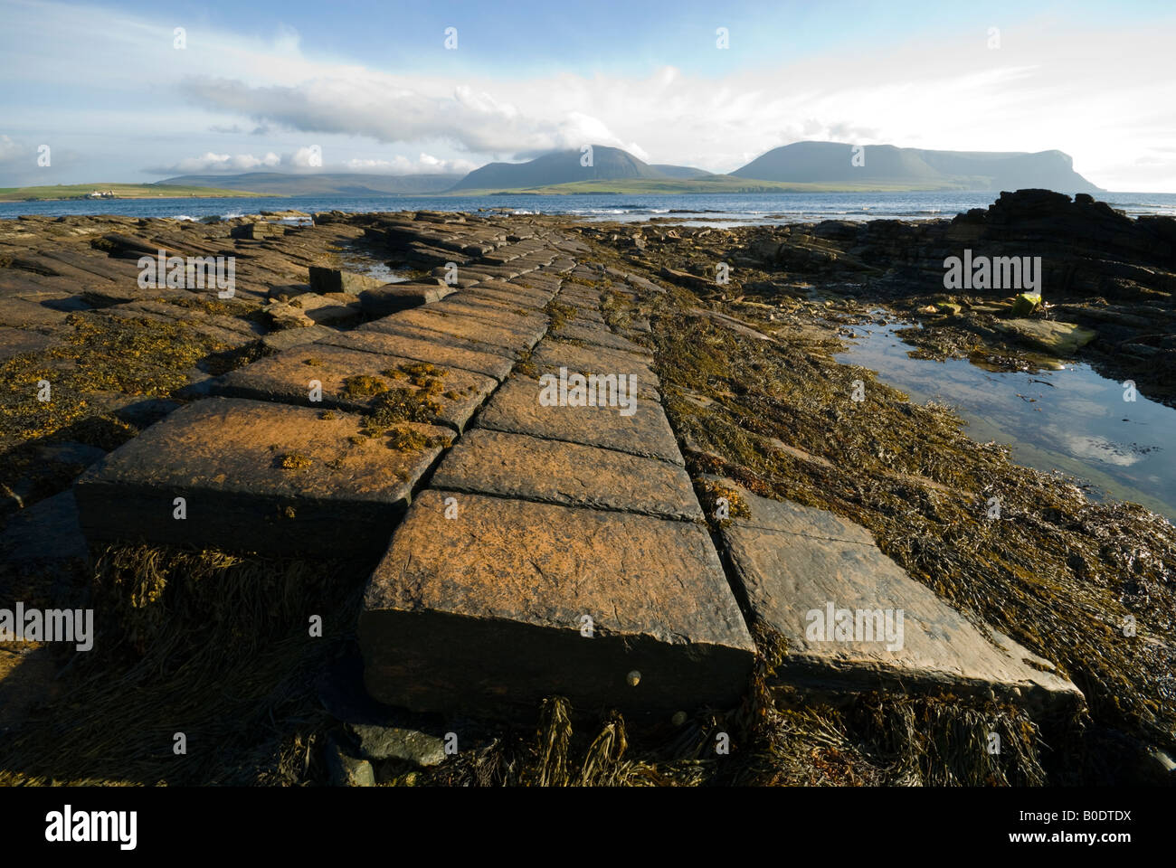The hills of Hoy over Hoy Sound, from the Ness, near Stromness, Orkney Islands, Scotland, UK ...
