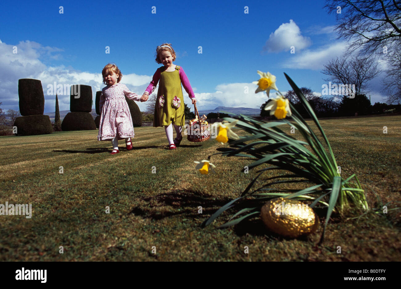 Girls on an Easter egg hunt in Lancashire, UK Stock Photo - Alamy