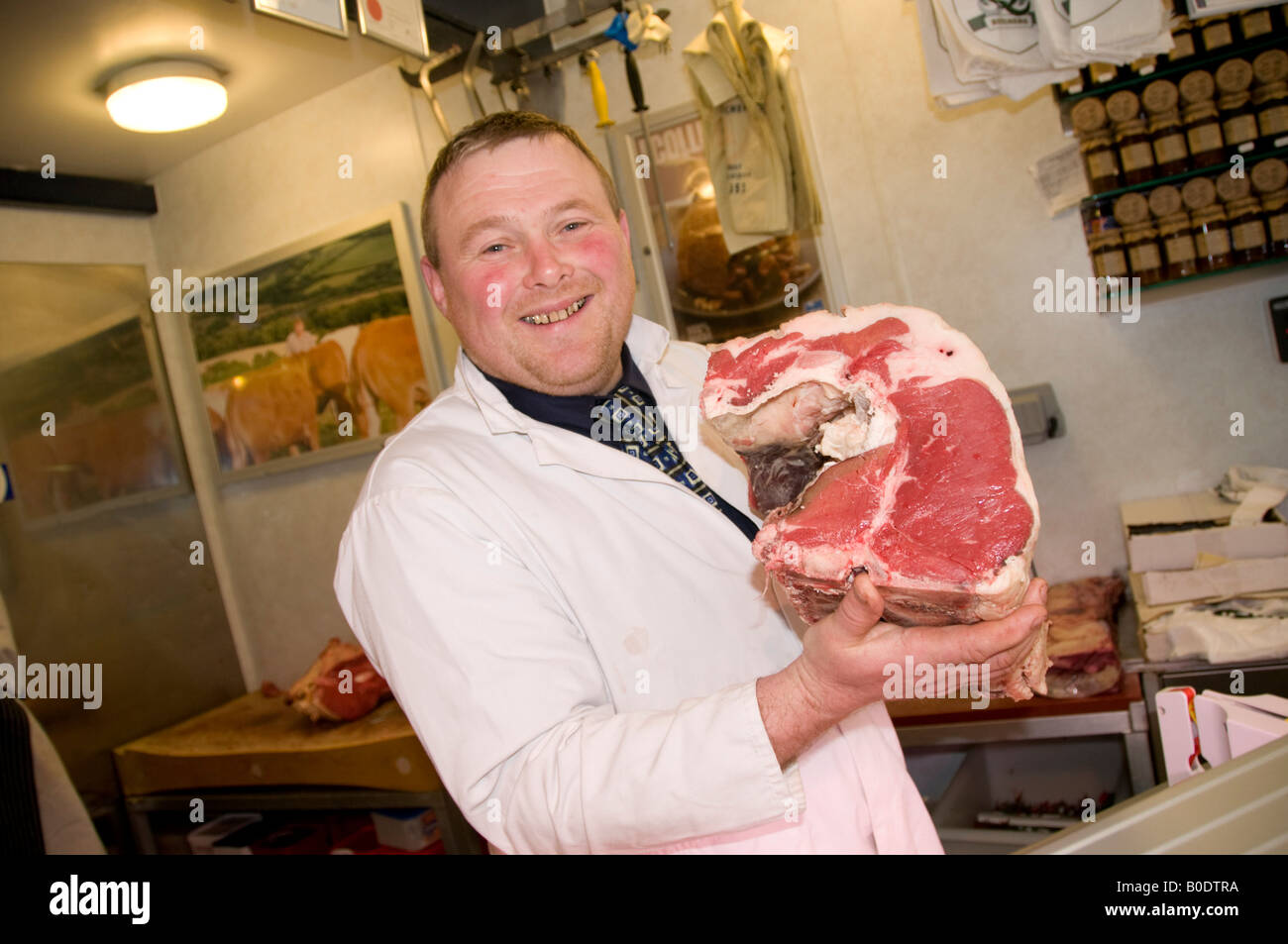 Butcher with a joint of meat hi-res stock photography and images - Alamy
