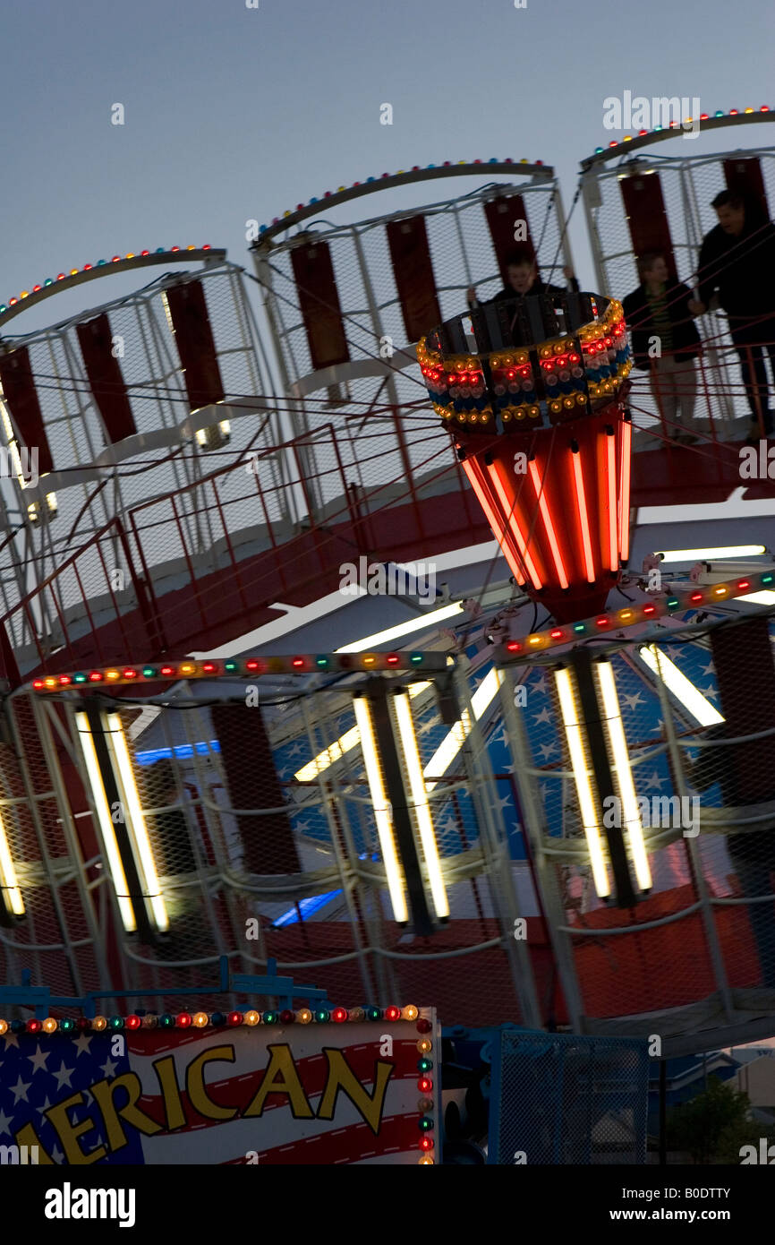 Spinning Round-Up Amusement Ride at Night Stock Photo - Alamy