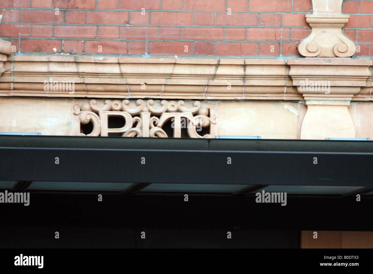 Partially obscured ornate sign saying "PIT" on the Hackney Empire old ...