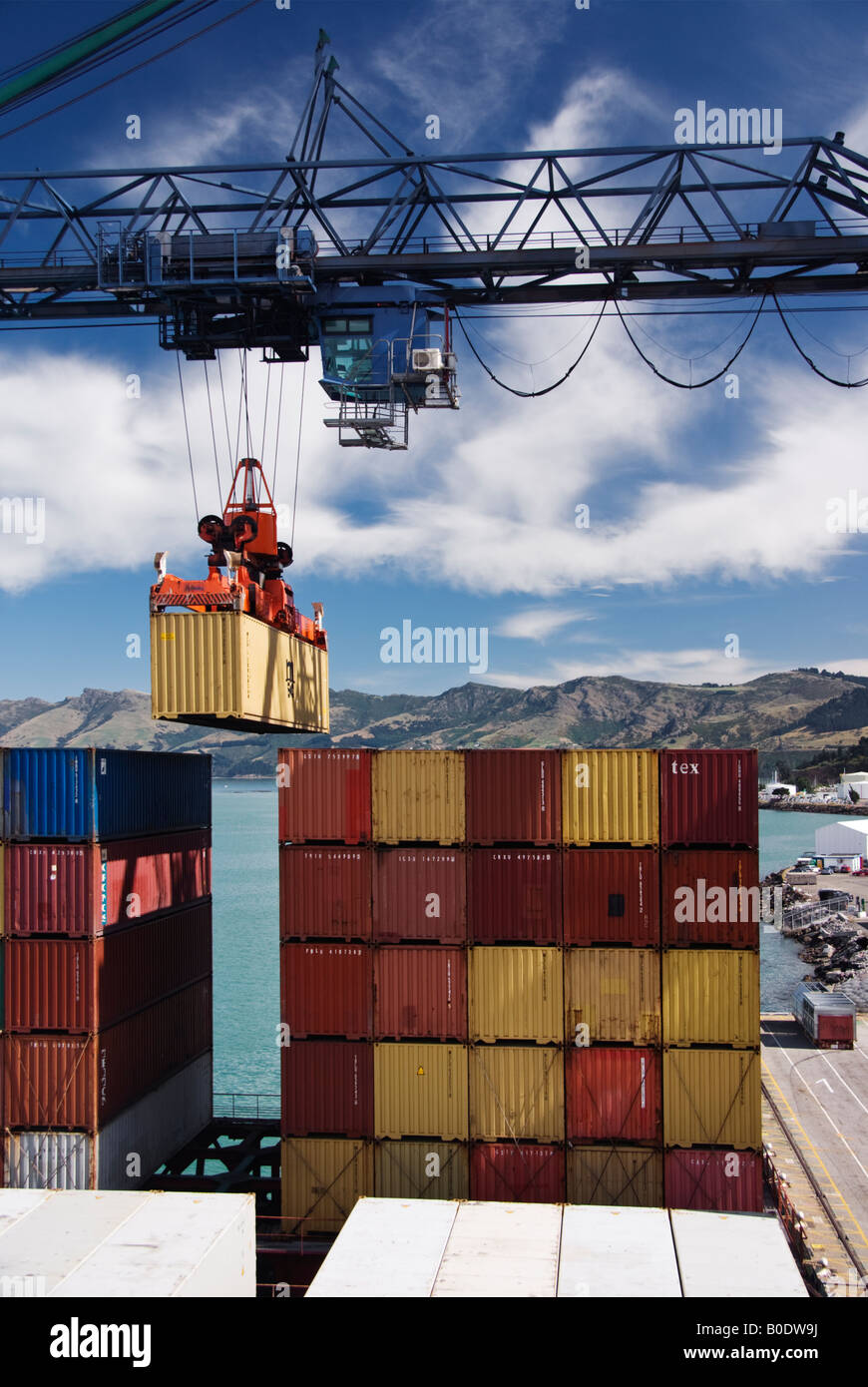 A view of container stacks on a container ship with a container being ...