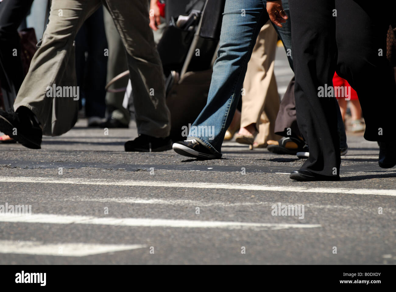 People crowd crossing the street in a city Stock Photo - Alamy