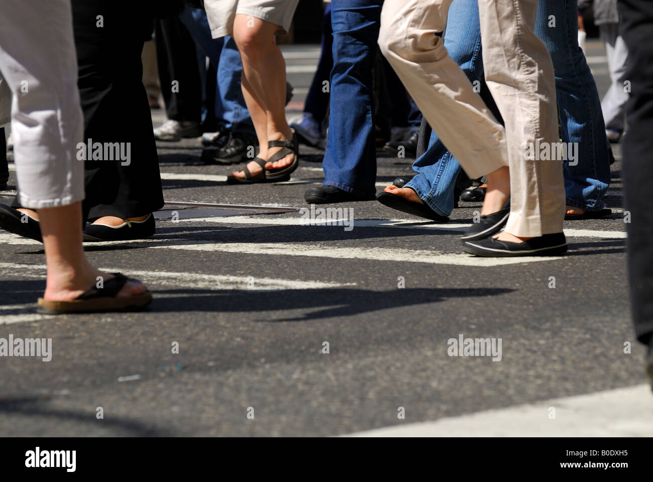 People crowd crossing the street in a city Stock Photo - Alamy