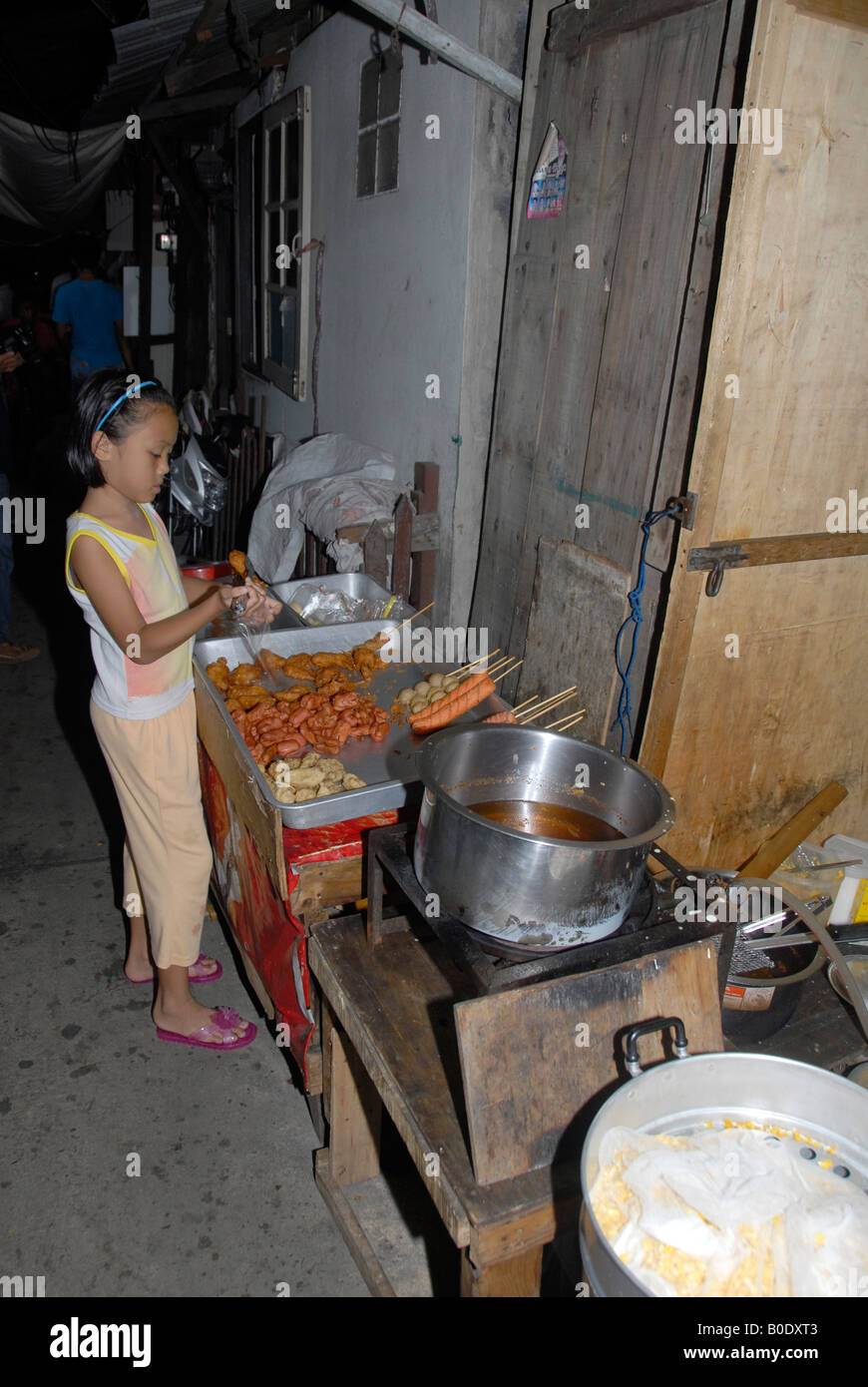 little girl selling food at klongtoei community, bangkok thailand Stock ...