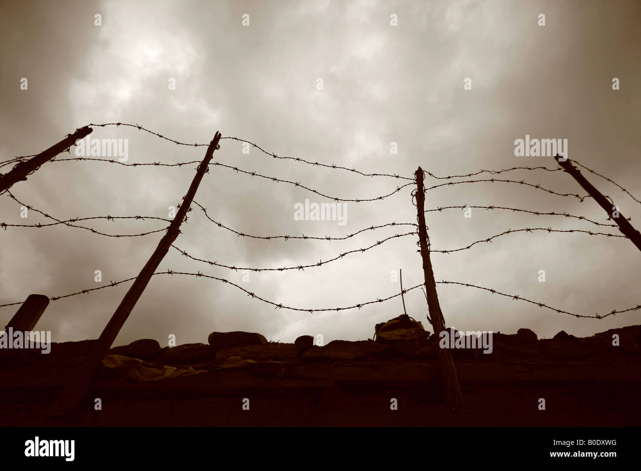 Barbed wire fence wall hi-res stock photography and images - Alamy