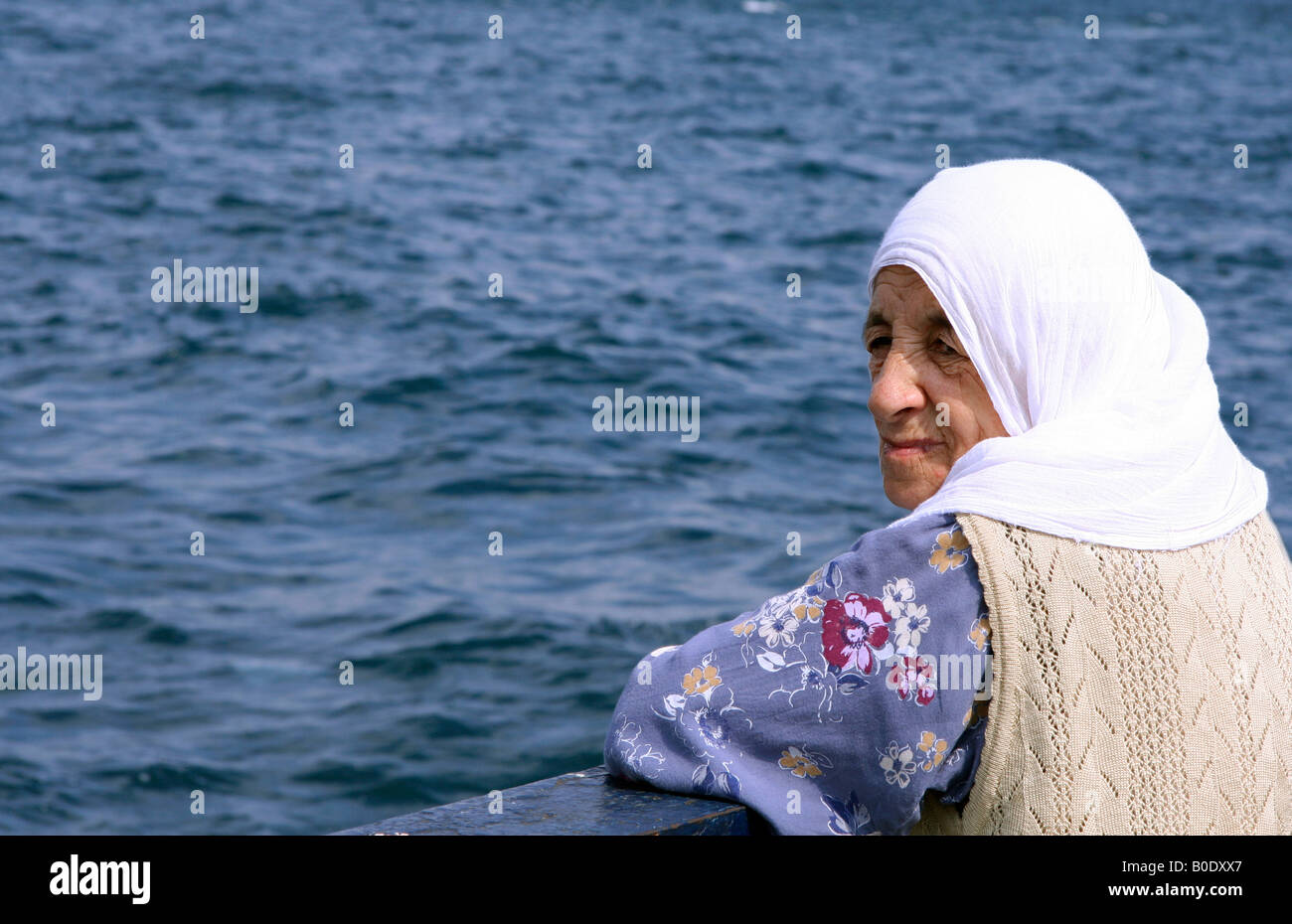 old traditional turkish lady gazing on the sea Stock Photo - Alamy