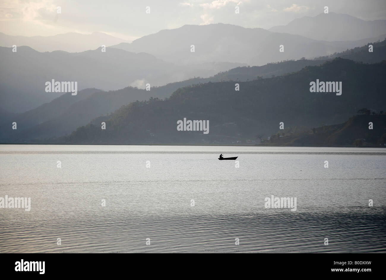 boat on fewa lake at sunset pokhara nepal Stock Photo - Alamy
