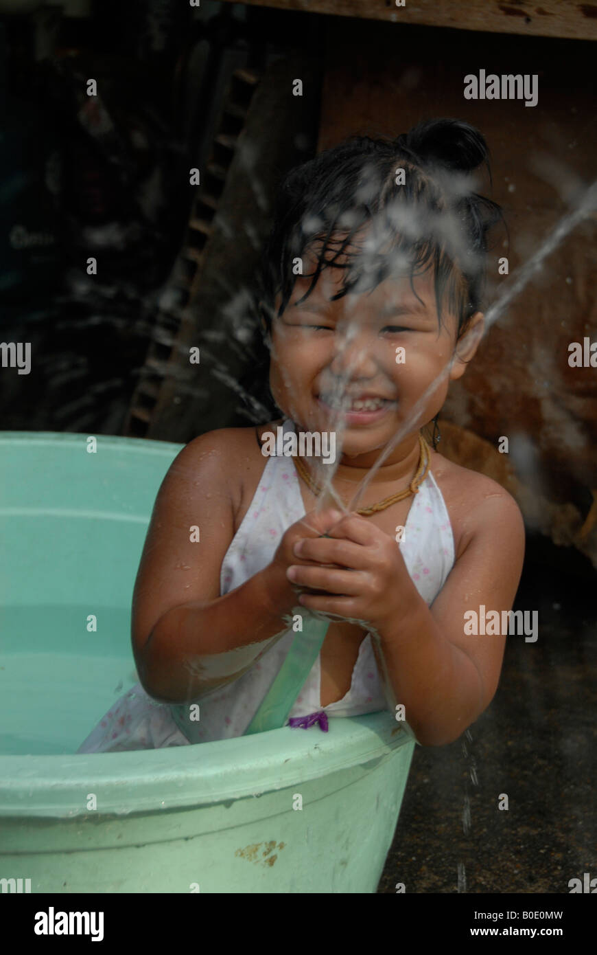 little girl at songkran festival, bangkok thailand Stock Photo - Alamy
